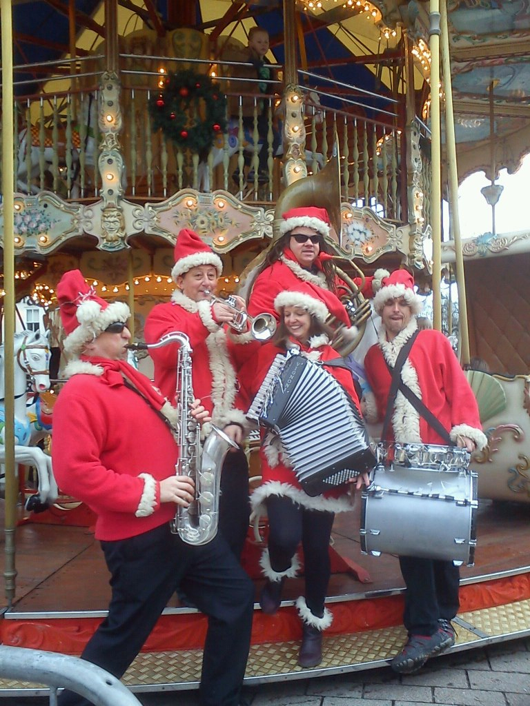 The Red Hot Santas - Strolling band.